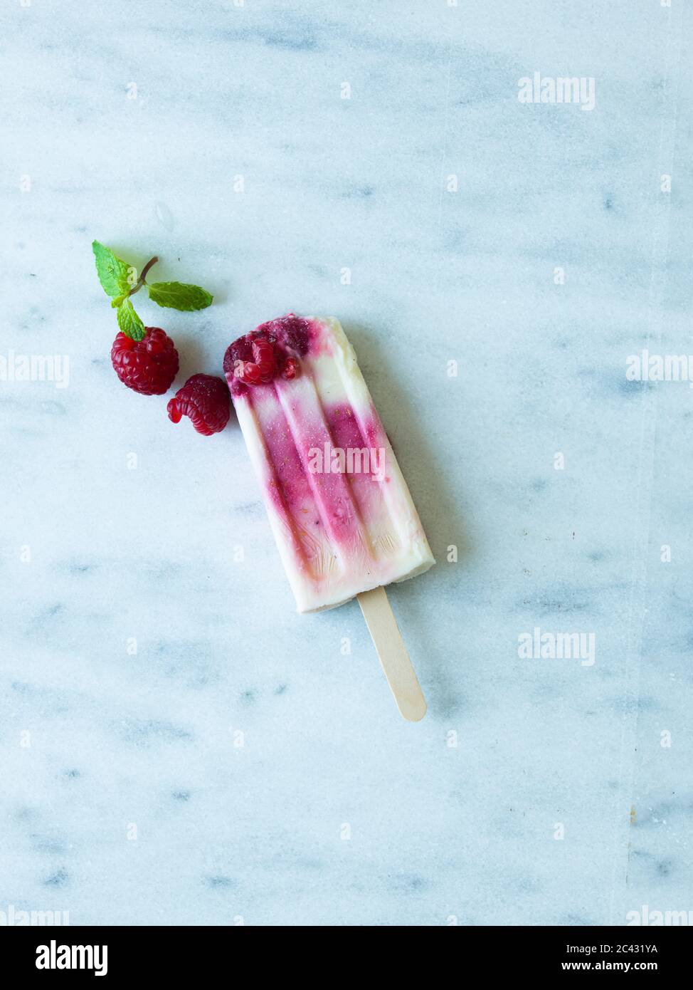 Raspberry swirl yoghurt lollies Stock Photo - Alamy