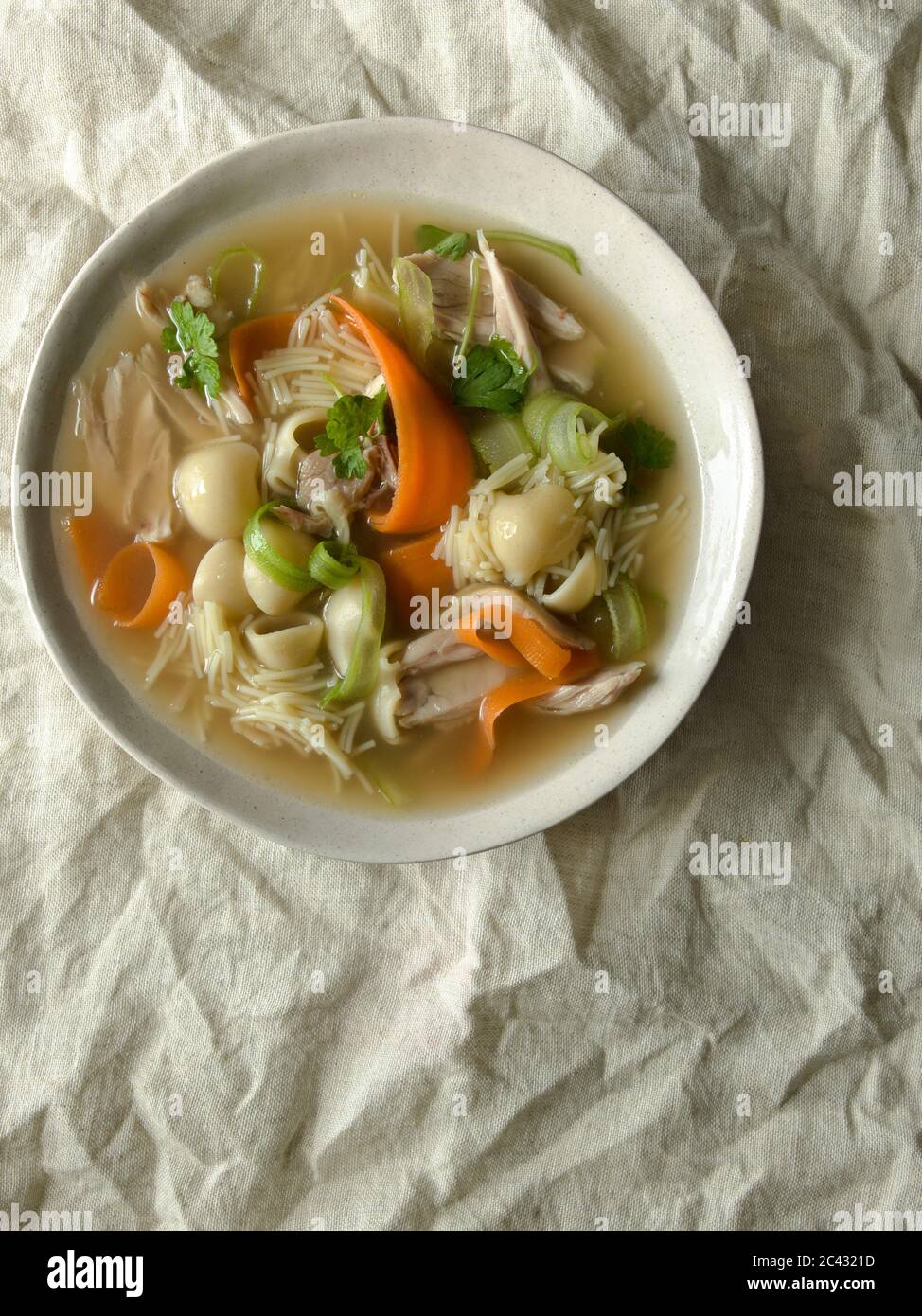 Chicken broth with vegetables Stock Photo - Alamy