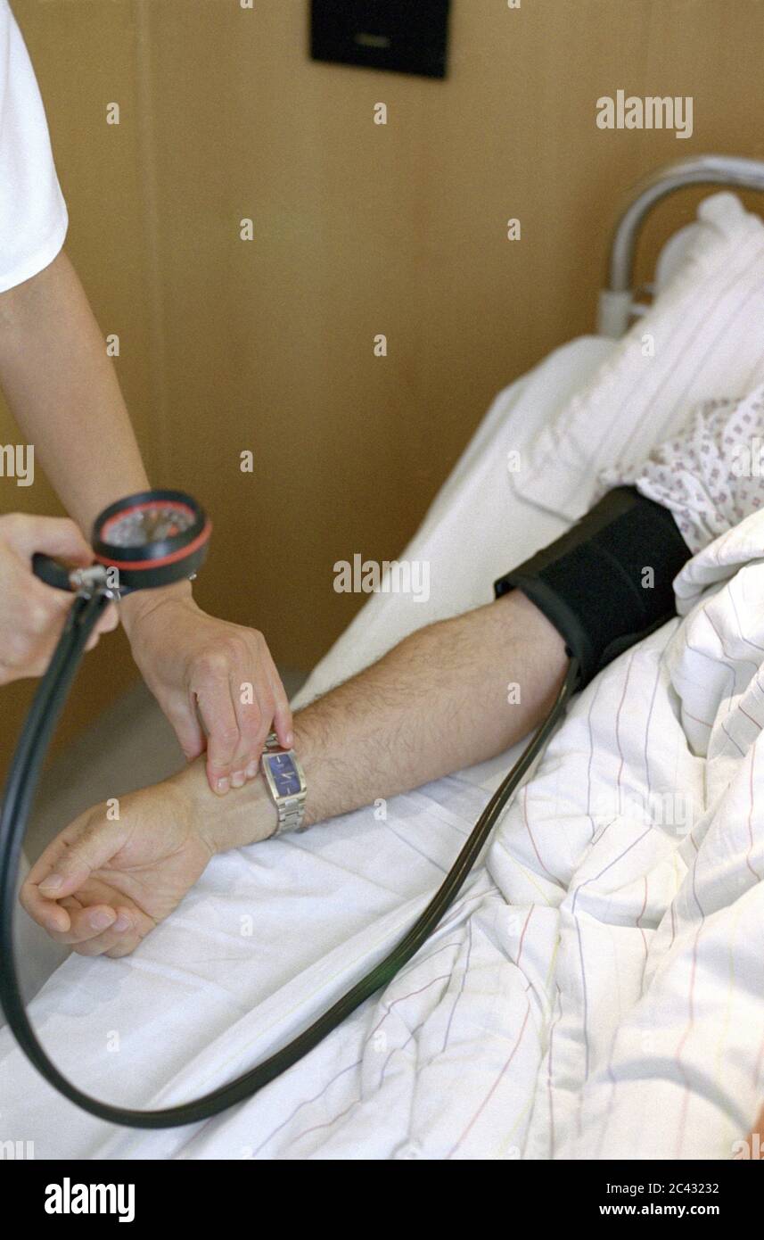 Blood pressure measurement - hospital Stock Photo - Alamy