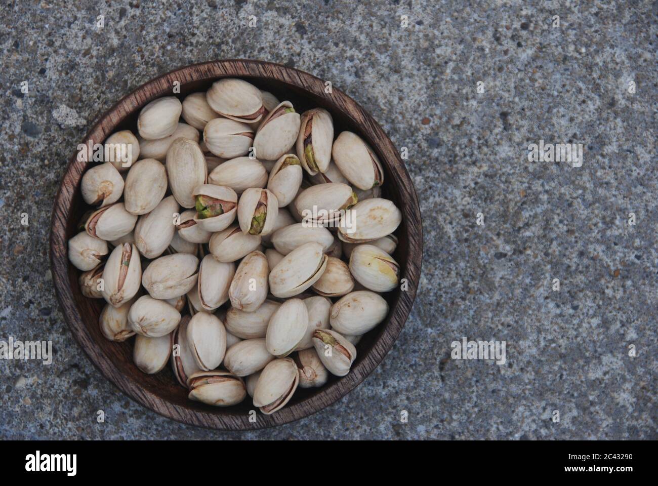 Spoon full of Pistachio Nuts Stock Photo - Alamy