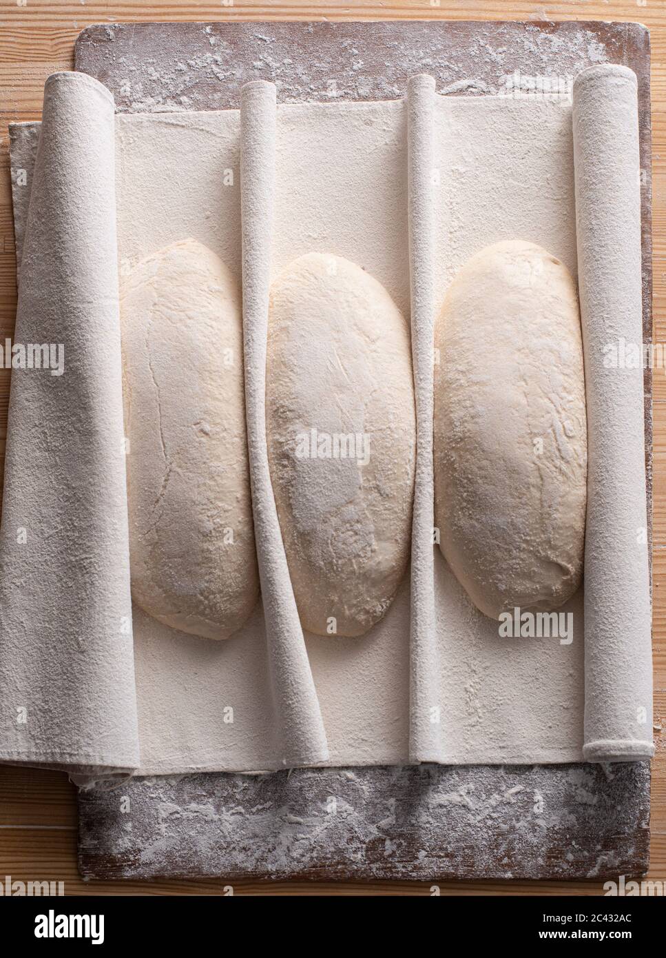 Pre-shaped bread dough in Couche Stock Photo - Alamy