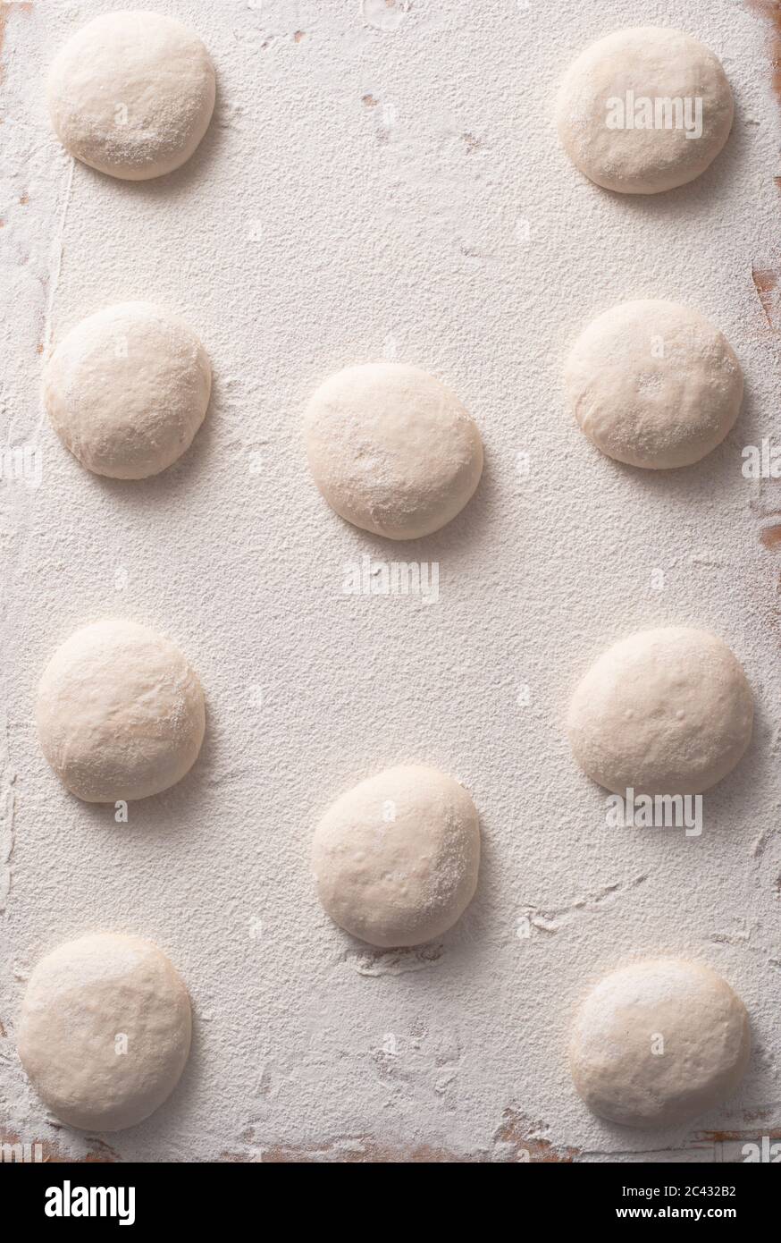 Pre shaped bread dough on floured surface Stock Photo - Alamy