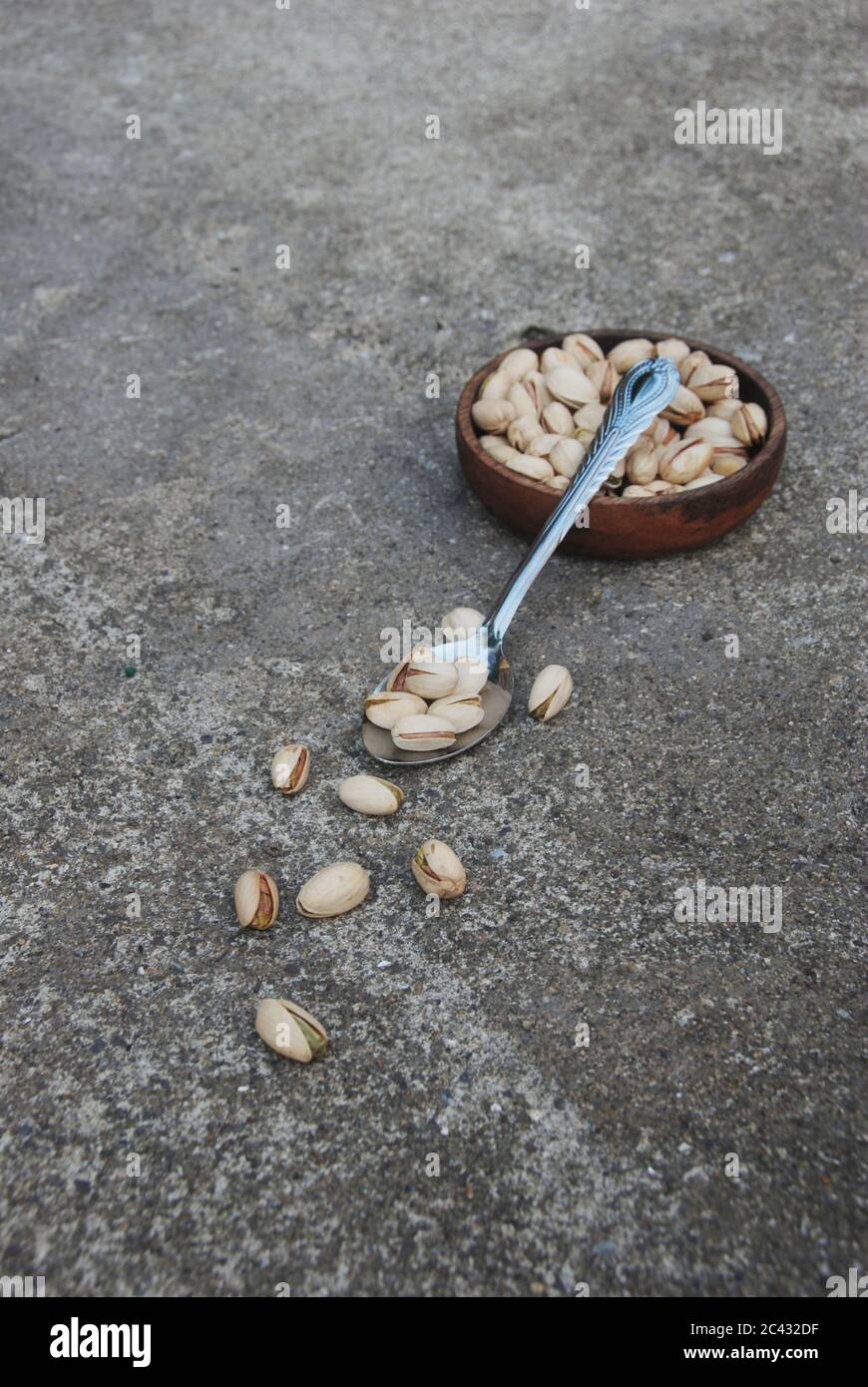 Spoon full of Pistachio Nuts Stock Photo - Alamy