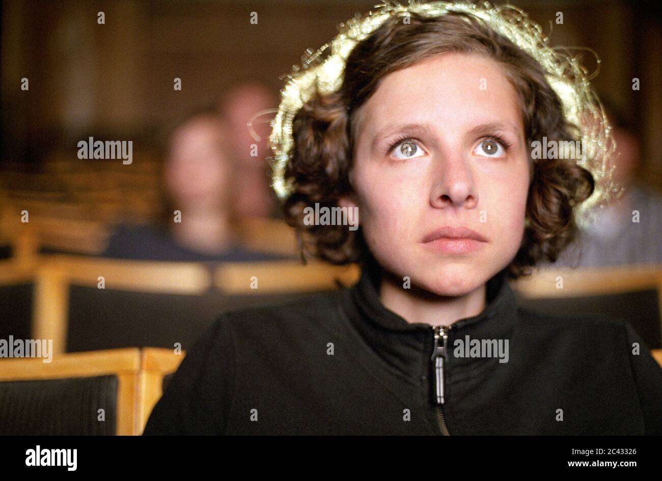 Young woman looks shocked - portrait - cinema Stock Photo - Alamy
