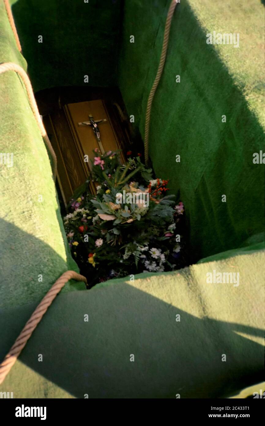 View of a coffin in the grave Stock Photo - Alamy