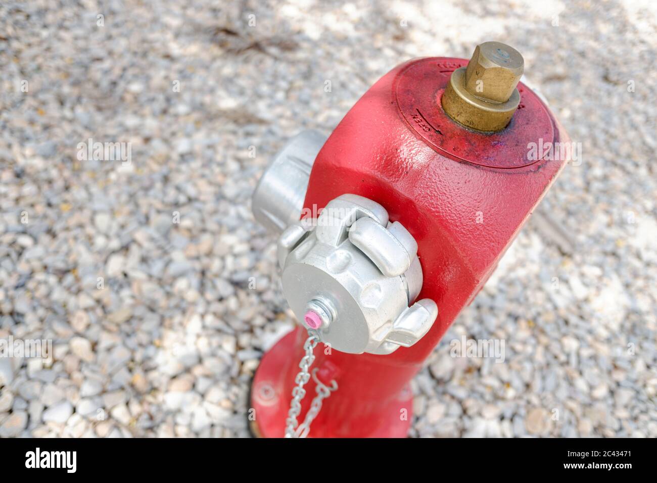 Red metal fire hydrant on the street in an industrial area for fire ...