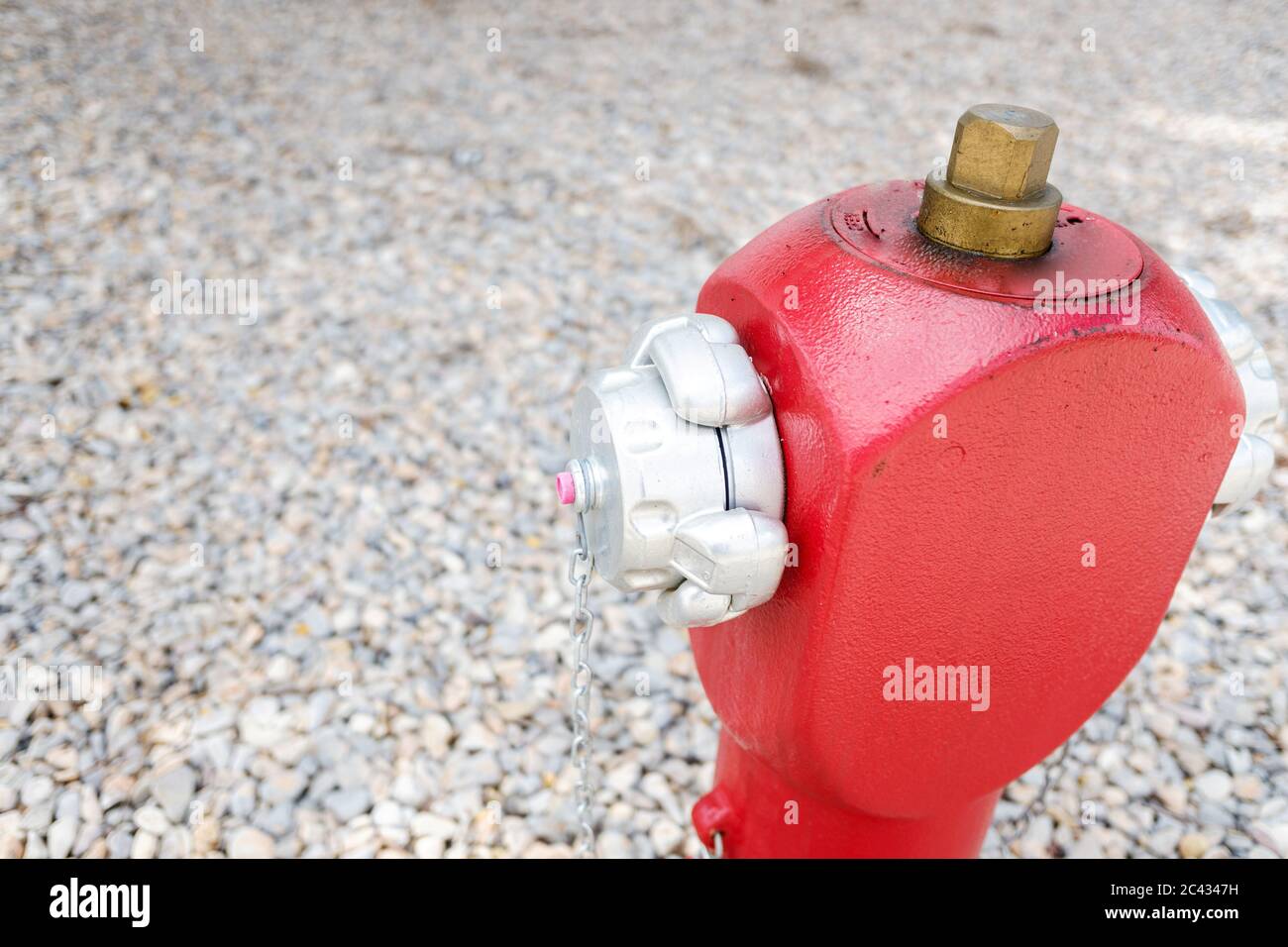 Red fire hydrant or fireplug connection for firefighters in public road ...