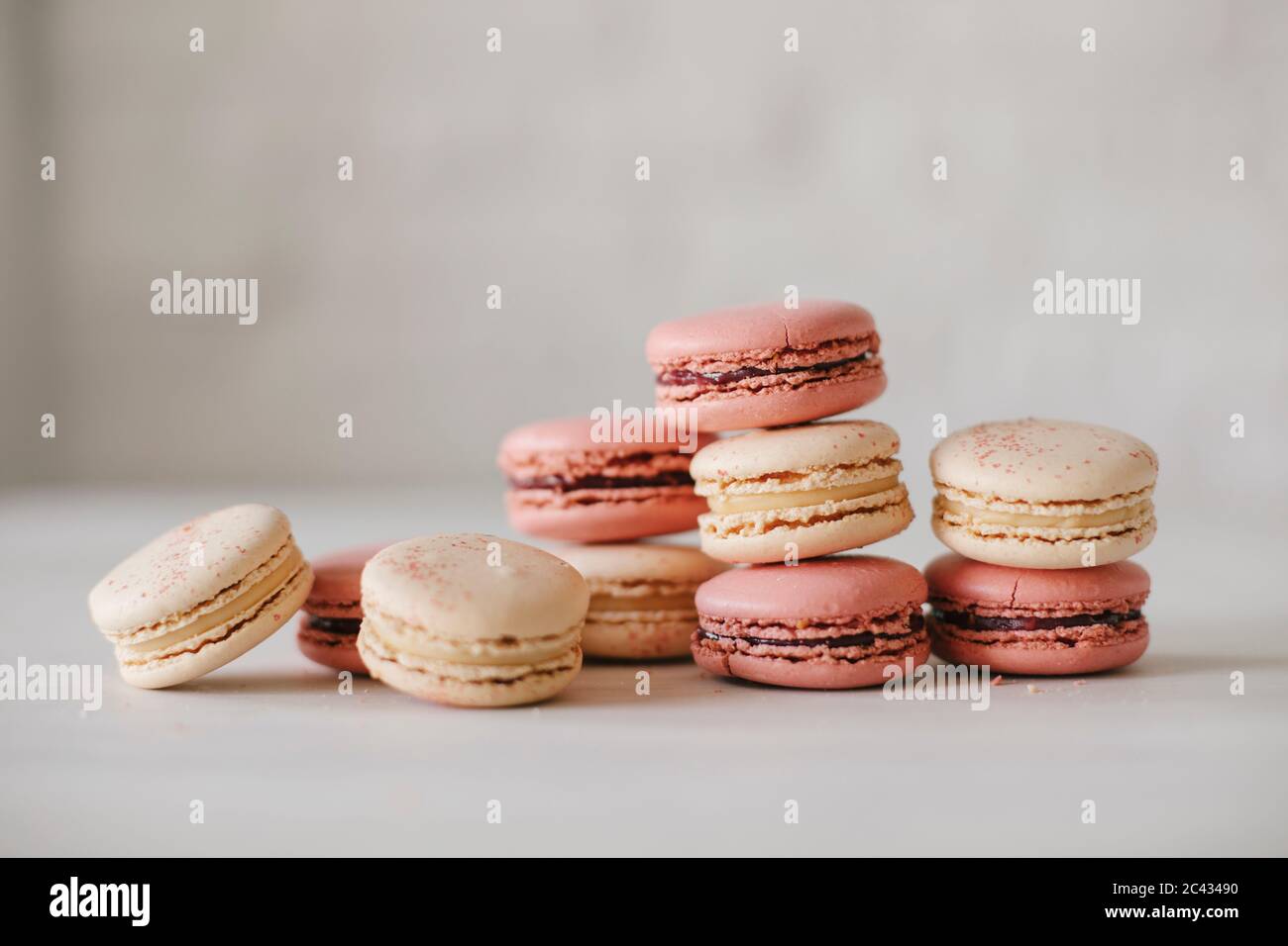 Hand made macarons on a modern light background Stock Photo - Alamy