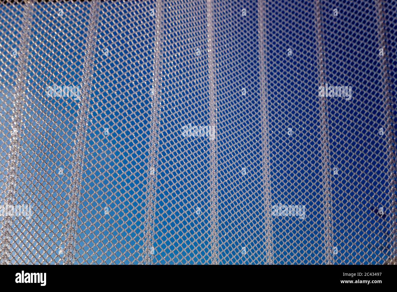 net made of nylon protects a summer window from mosquitoes and insects ...
