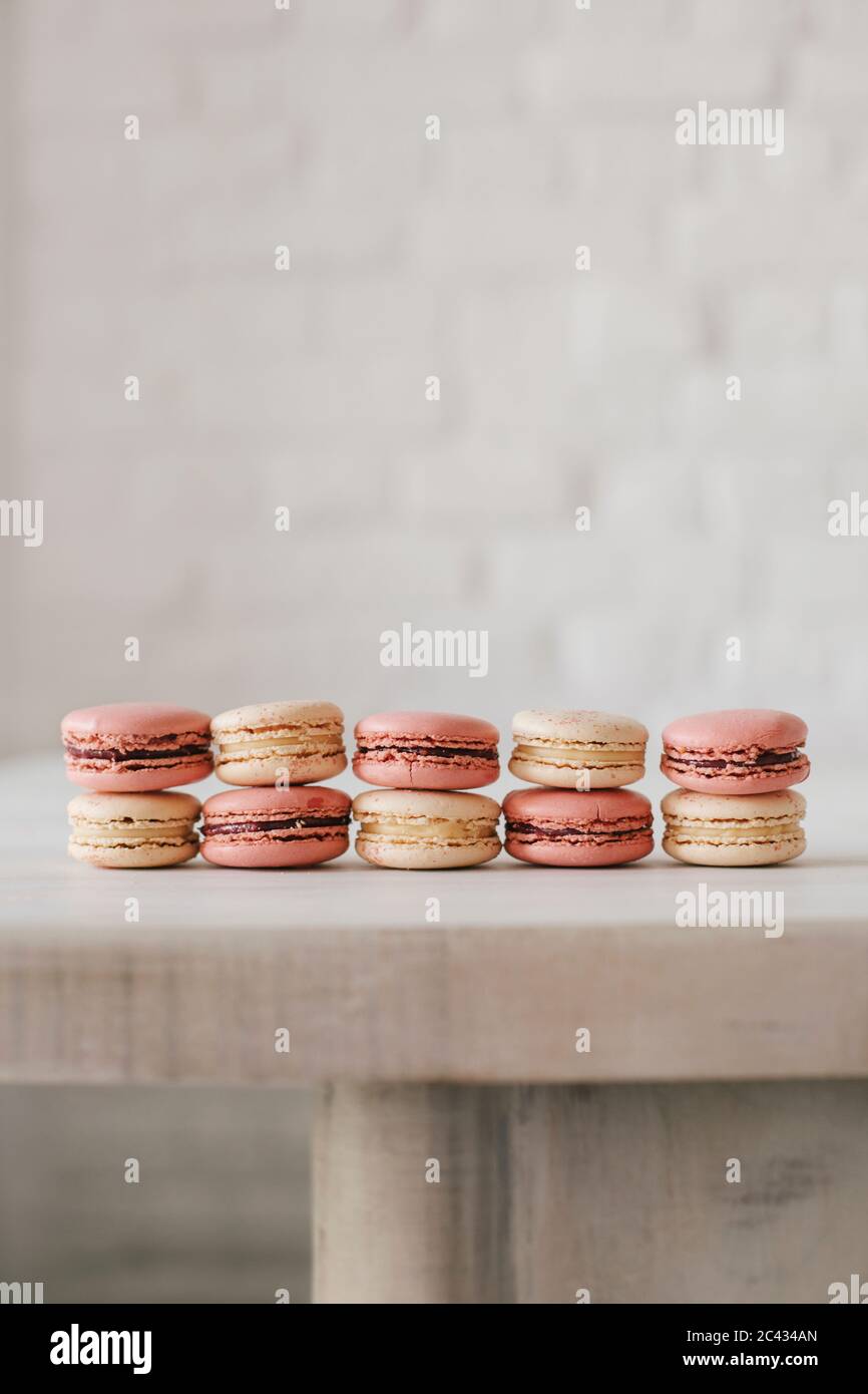 Hand made macarons on a modern light background Stock Photo - Alamy