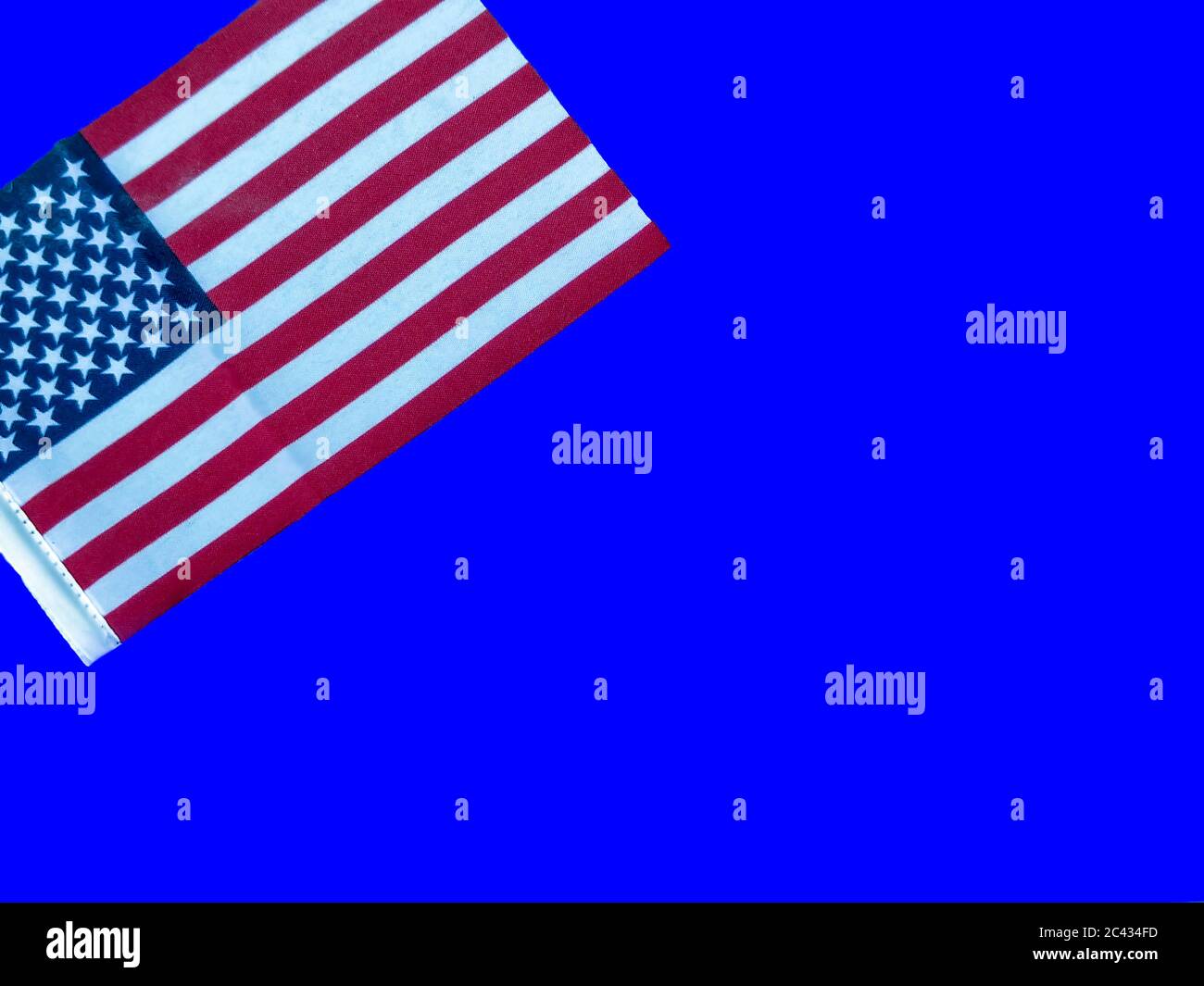 American Flag Against a Bright Blue Background Stock Photo - Alamy