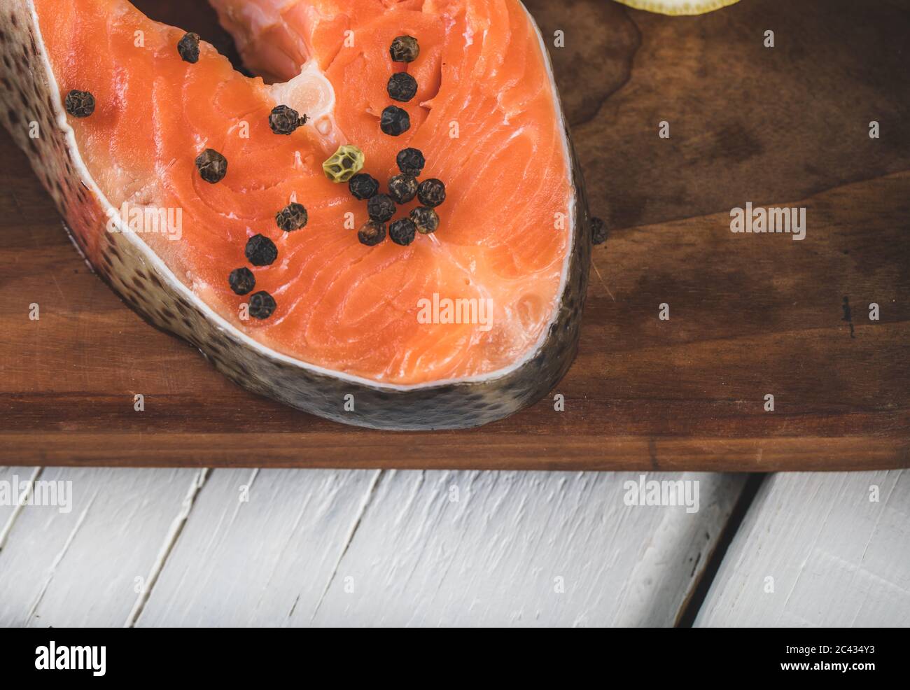 Salmon fish fillet with pepper, top view Stock Photo - Alamy