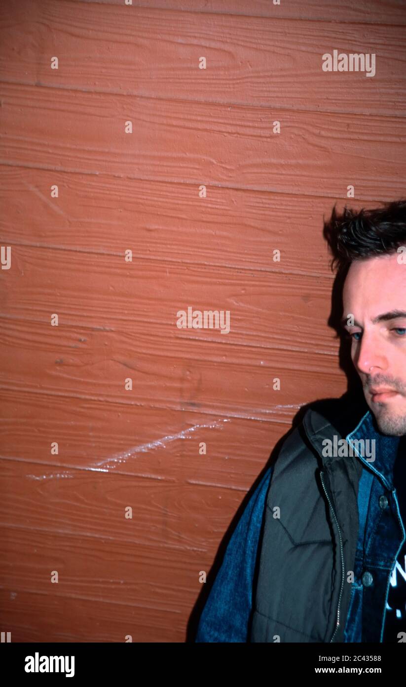 A man in front of a wall Stock Photo - Alamy