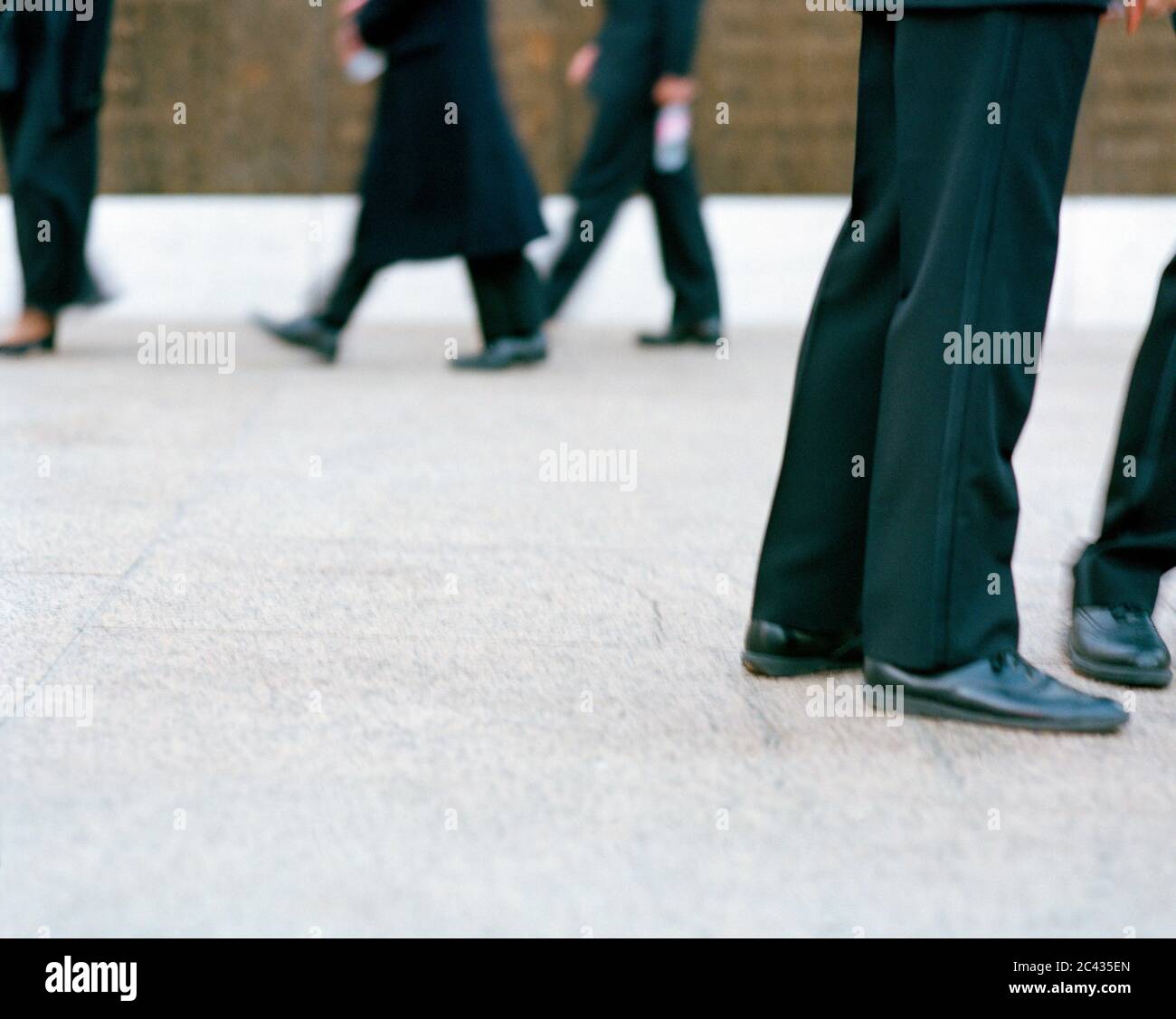 Business people in the yard - legs - meeting Stock Photo - Alamy