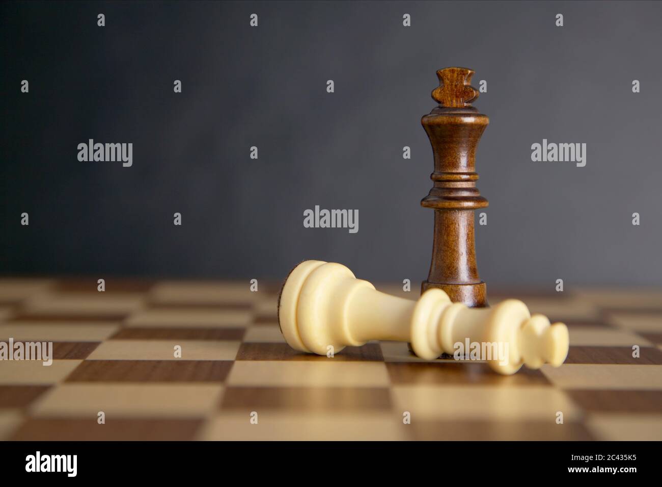Chess pieces, white king checkmate Stock Photo - Alamy