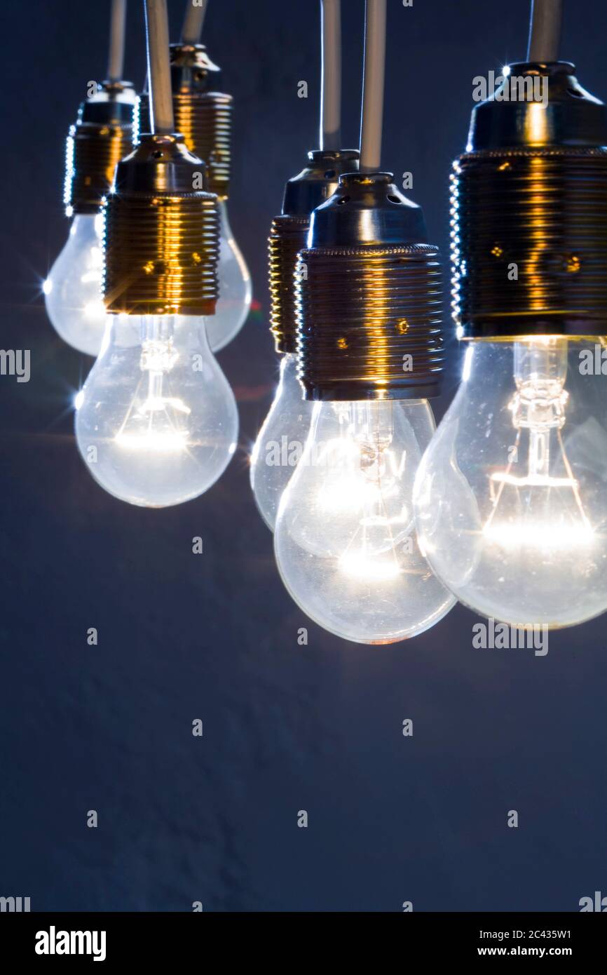 Light bulbs hang in a row Stock Photo - Alamy