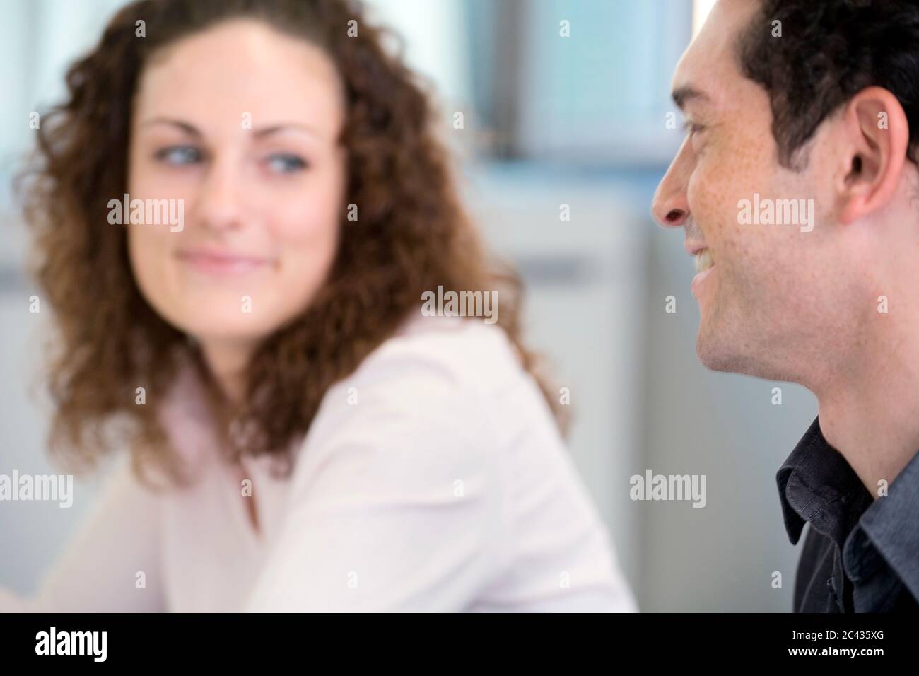 Two business people in conversation Stock Photo - Alamy