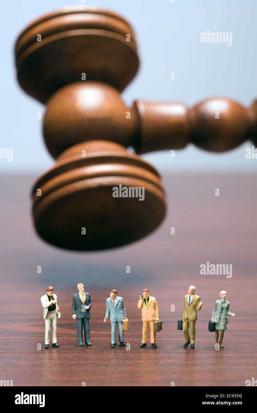 Judge gavel over human figures Stock Photo - Alamy