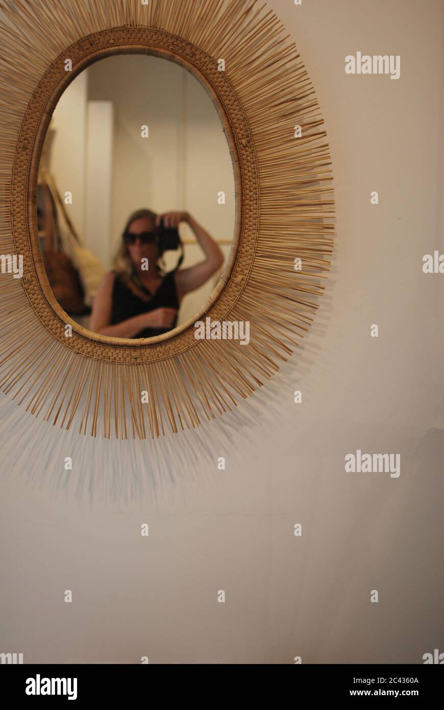 Sneaky self portrait in the mirror Stock Photo - Alamy