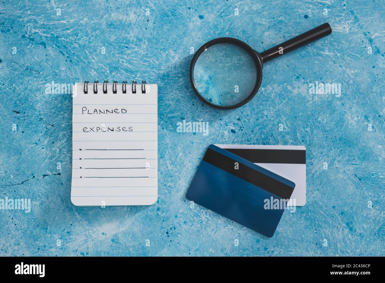 managing money and finance concept, planned expenses notepad with ...