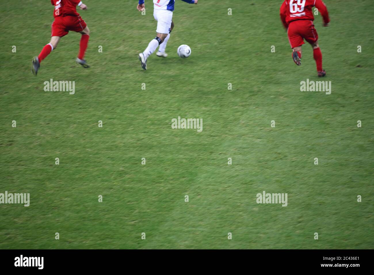 Football players in action Stock Photo - Alamy