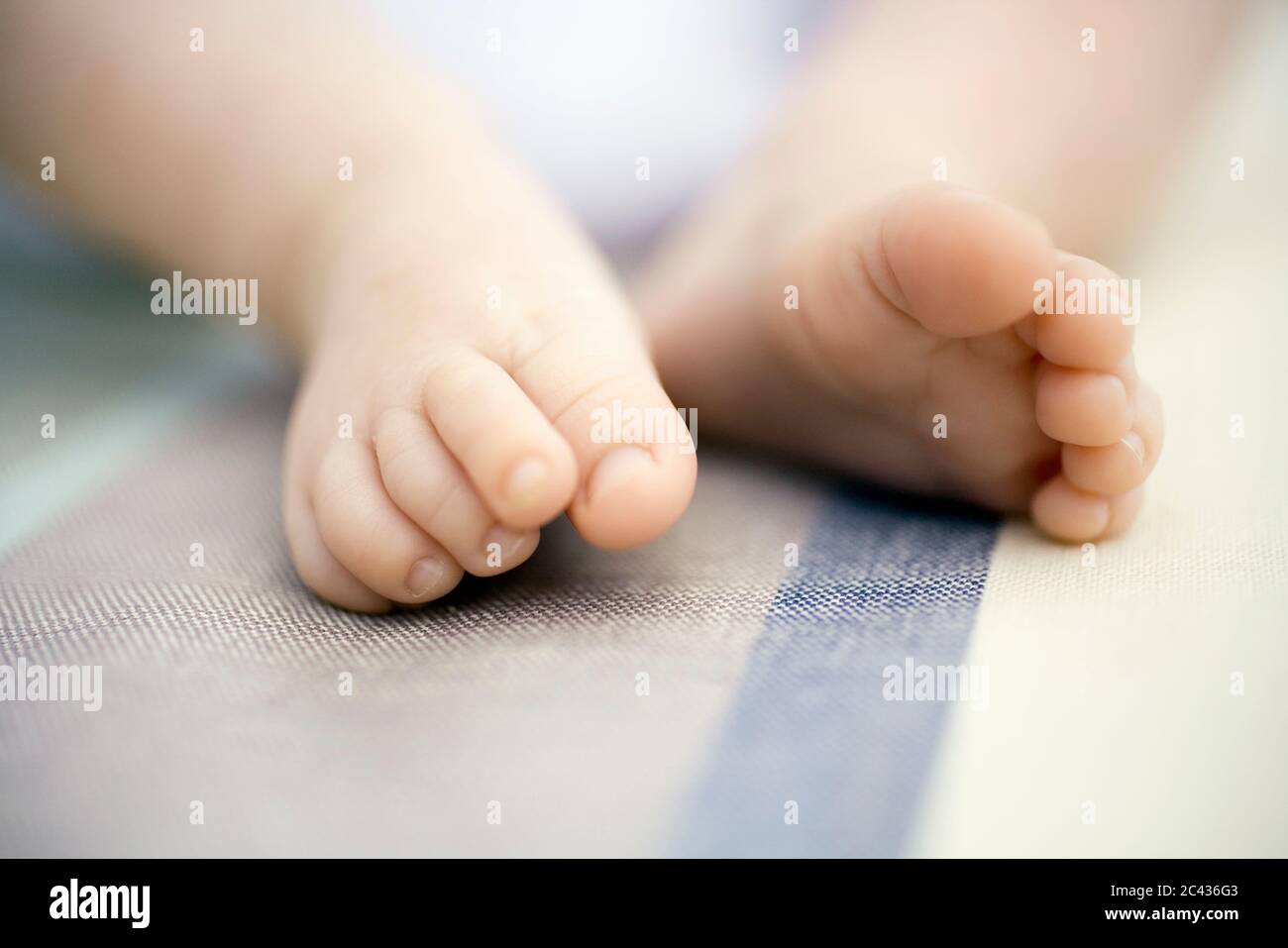 Bare feet of an infant - skin - age Stock Photo - Alamy