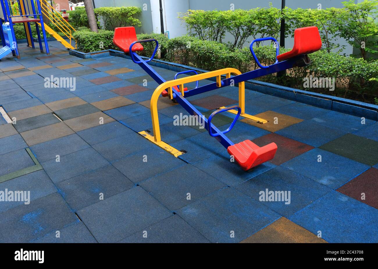 Closeup and selective focus on double seesaws installed on the same ...