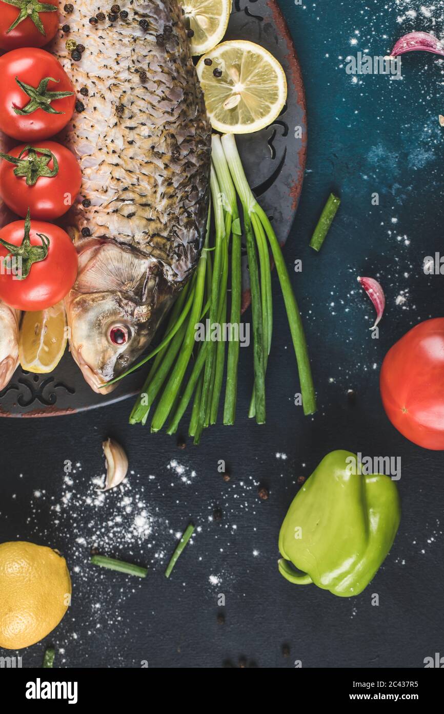 Fish, tomatoes, green onion, pepper and tomato Stock Photo - Alamy