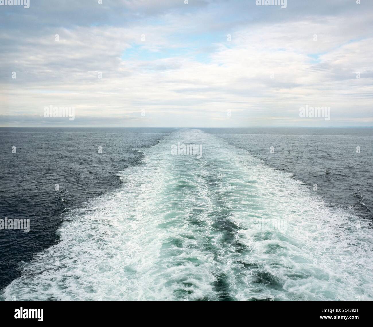 The trail of a large ship in the water - passing by - sea Stock Photo ...