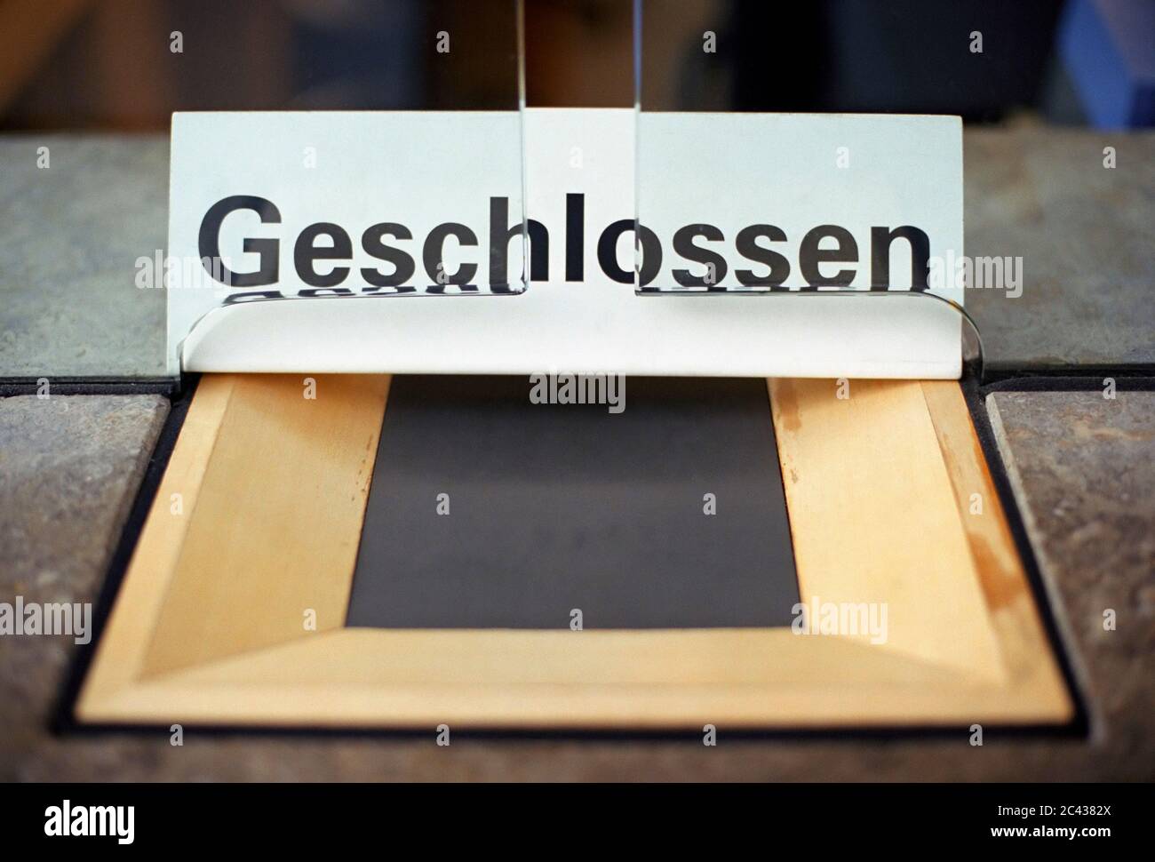 A closed sign stands at the counter of a bank - after work - bank Stock ...