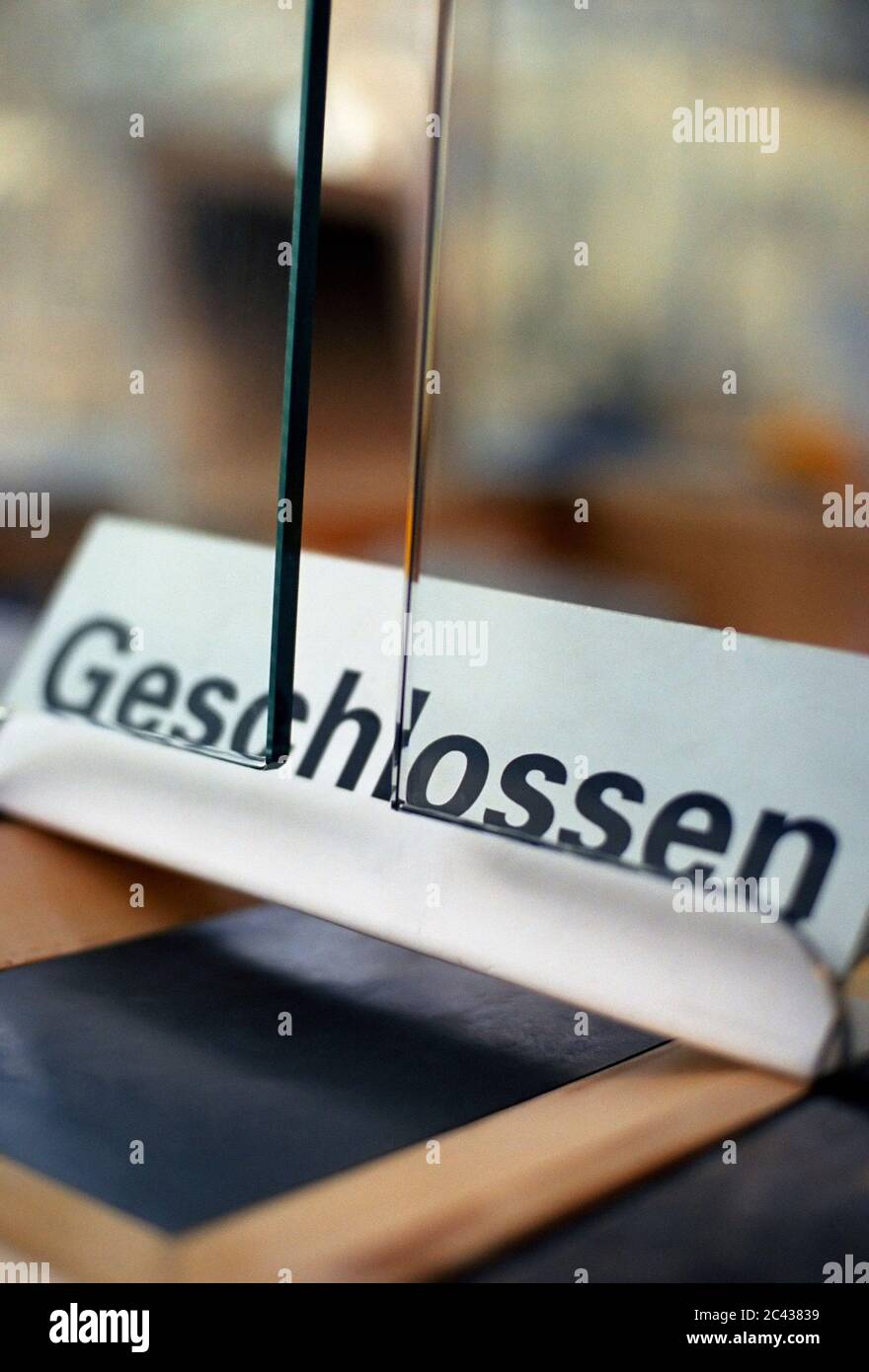 A closed sign on a bank counter - closing time - bench, white, brown ...