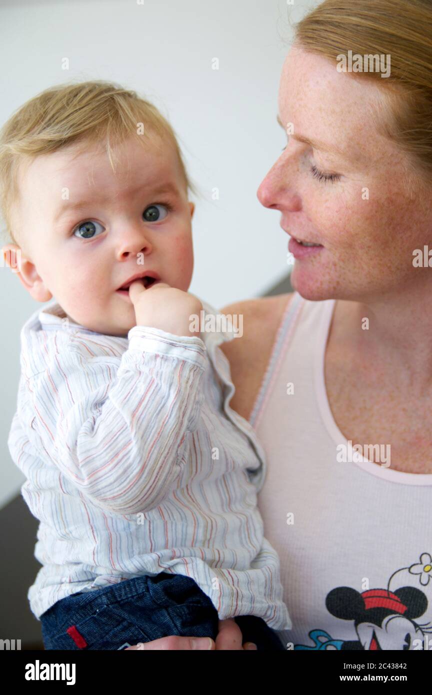 Mother with her baby in her arms - family - offspring Stock Photo - Alamy