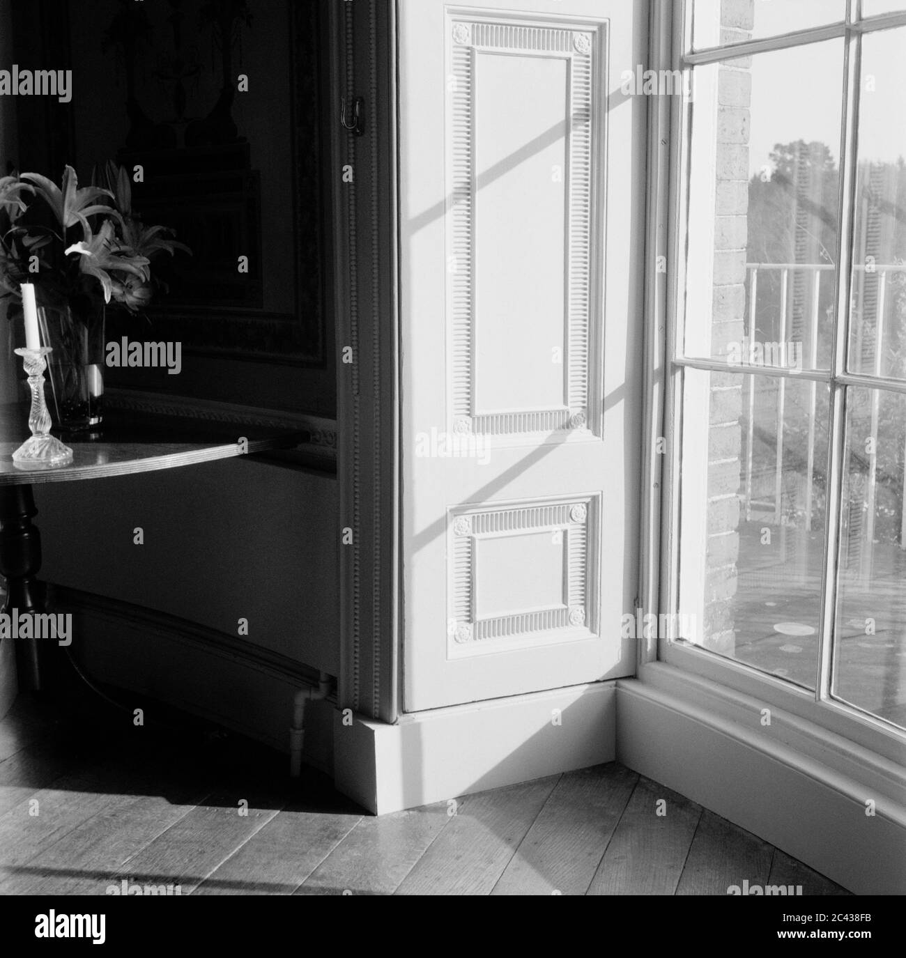 Sunlight falls through the window pane of an apartment building ...