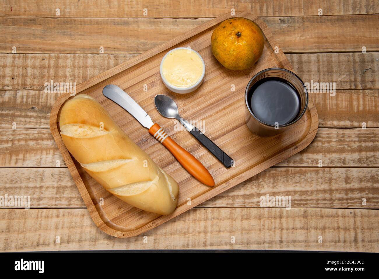 simple breakfast, with bread and butter, coffee and fruit, Top View ...