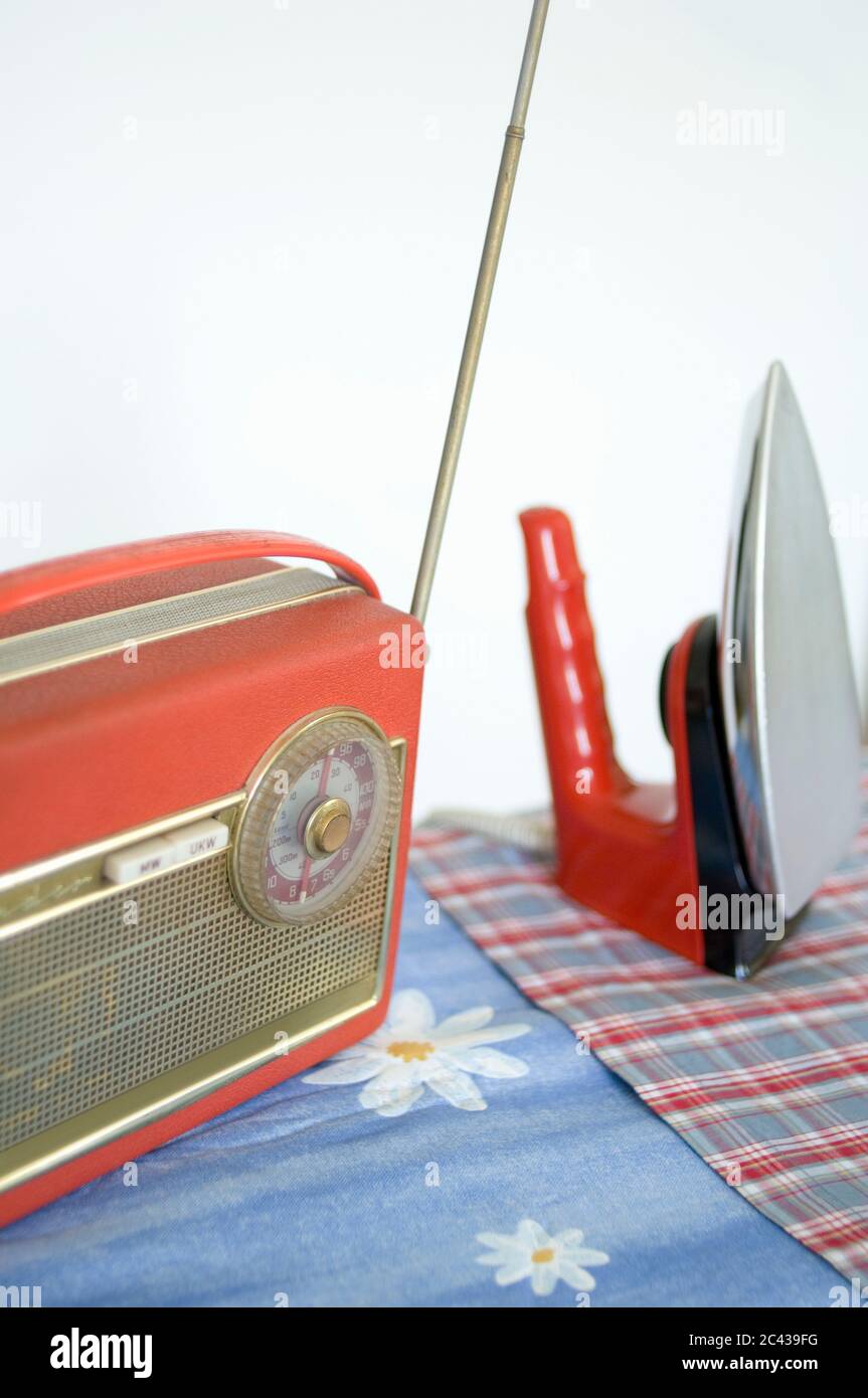 Old-fashioned, red radio on an ironing board - nostalgia - music Stock ...