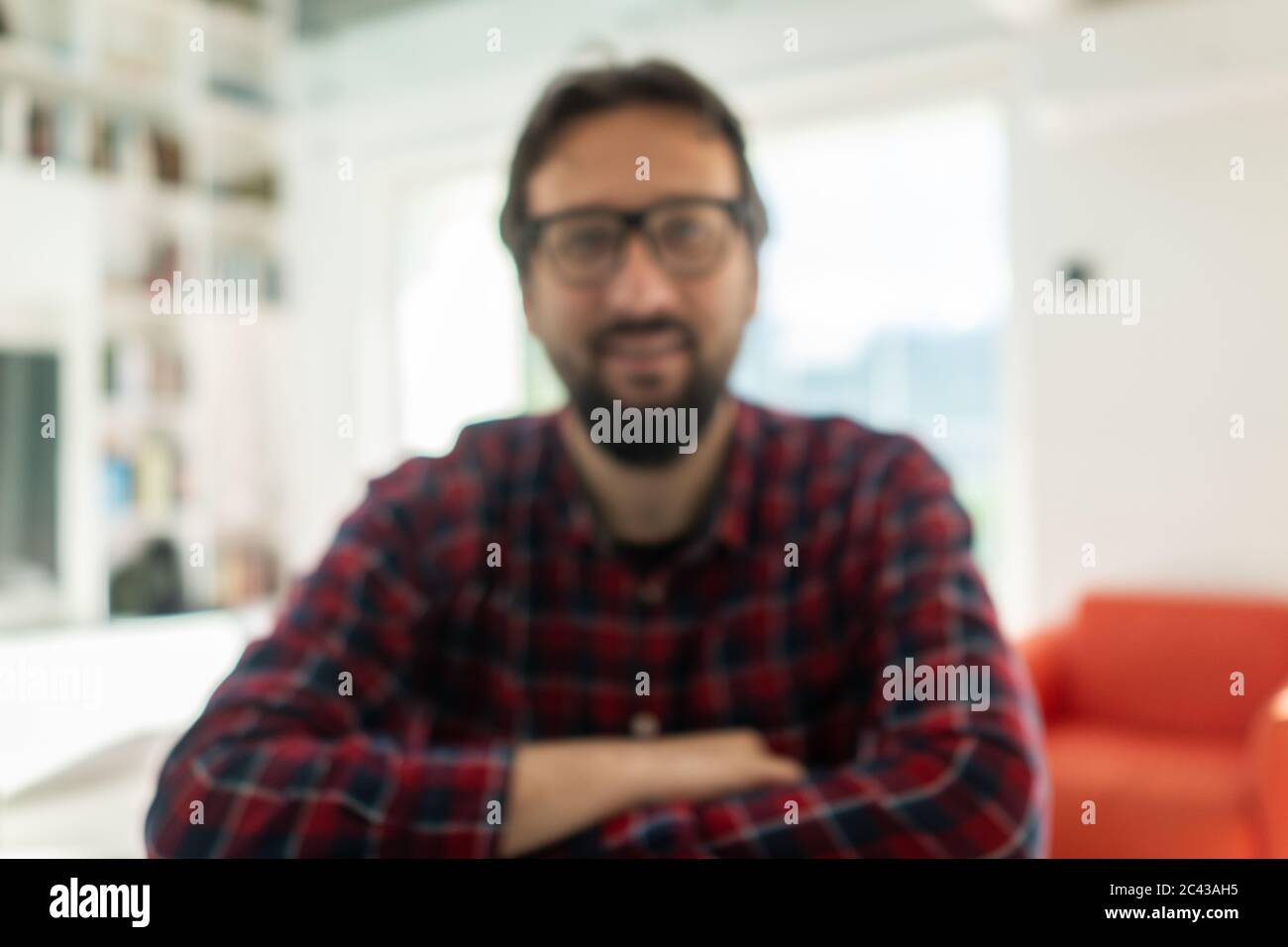 Man looking at screen working online (out of focus Stock Photo - Alamy