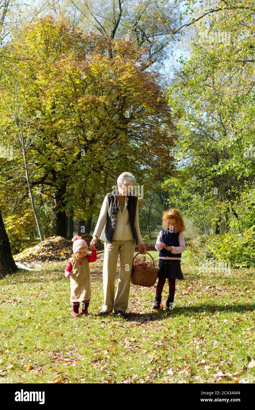 Old woman with two children Stock Photo - Alamy
