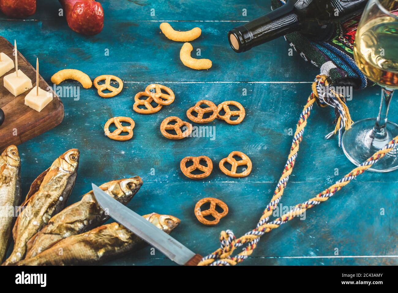 Dry fish and crackers on the blue table Stock Photo - Alamy
