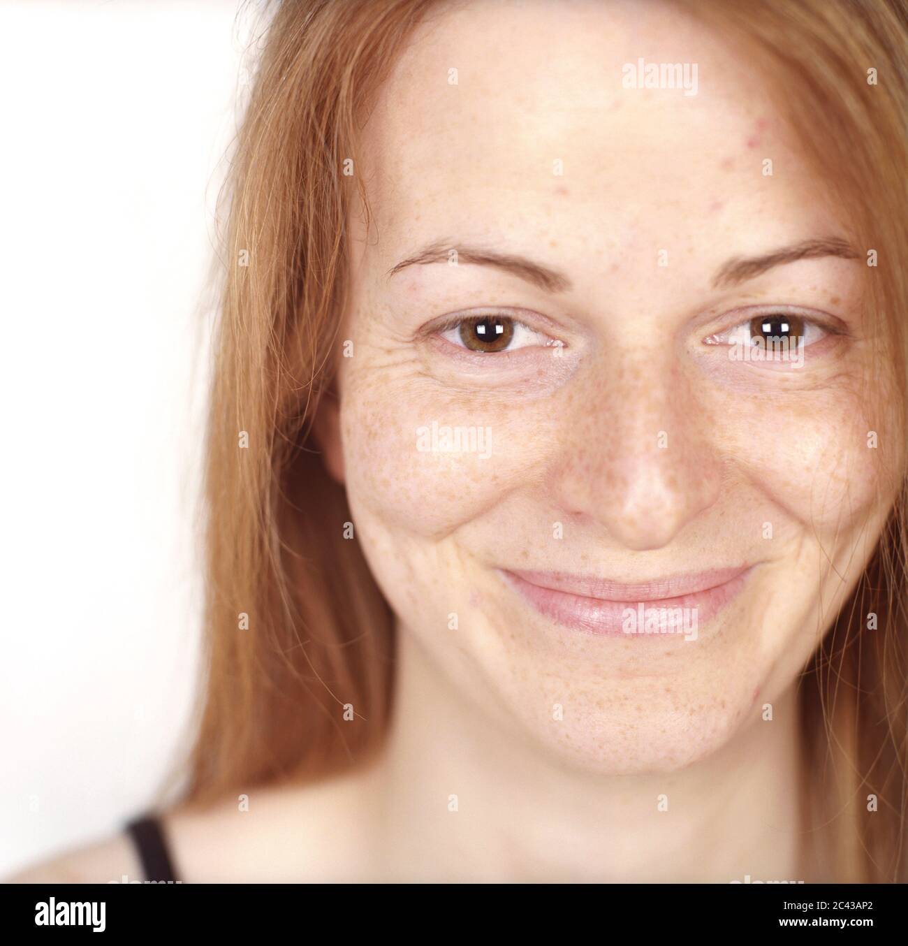 Woman with long, red hair that falls on her neck - physicality Stock ...