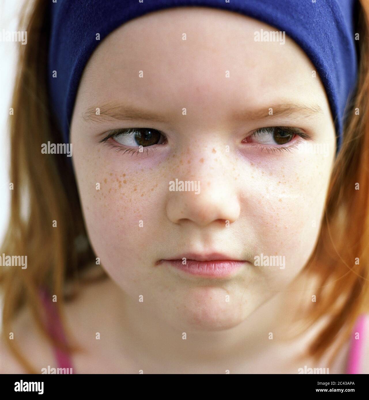 Red-haired girl with a blue ribbon in her hair - childhood Stock Photo ...