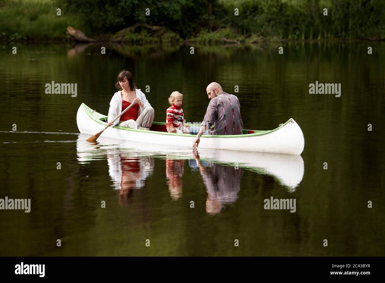 Family in a canoe Stock Photo - Alamy