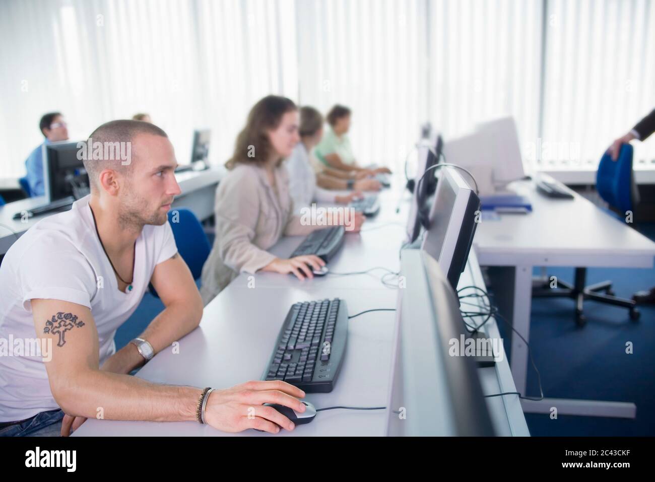 People in a computer training room Stock Photo - Alamy