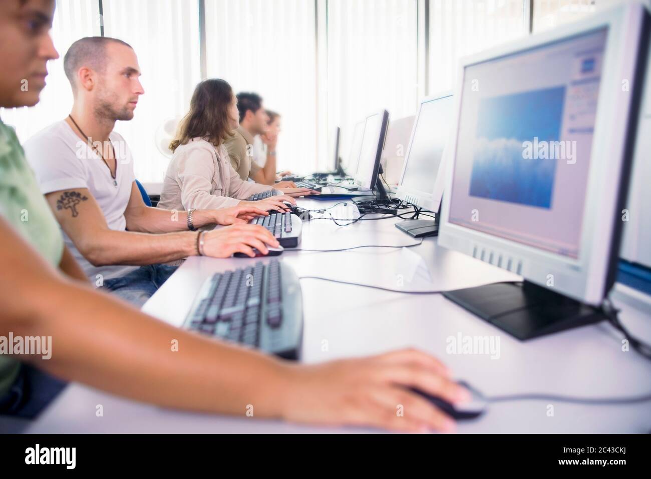 People in a computer training room Stock Photo - Alamy