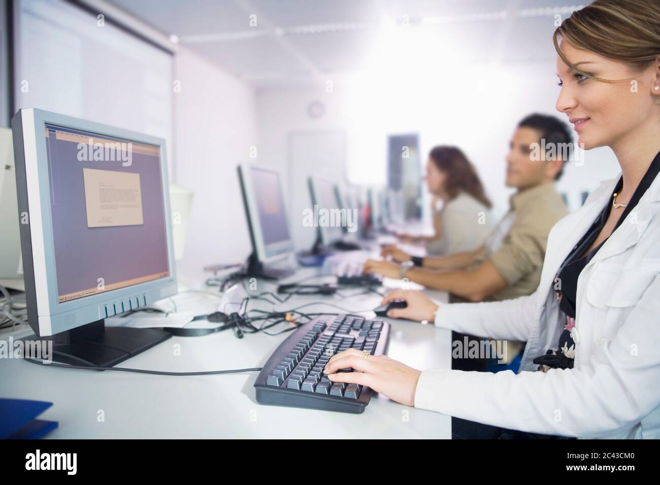 People in a computer training room Stock Photo - Alamy