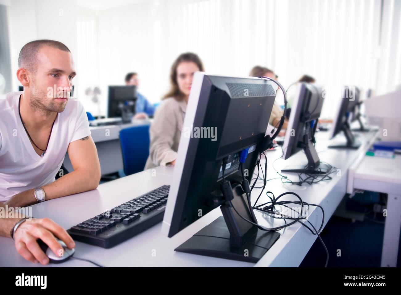 People in a computer training room Stock Photo - Alamy