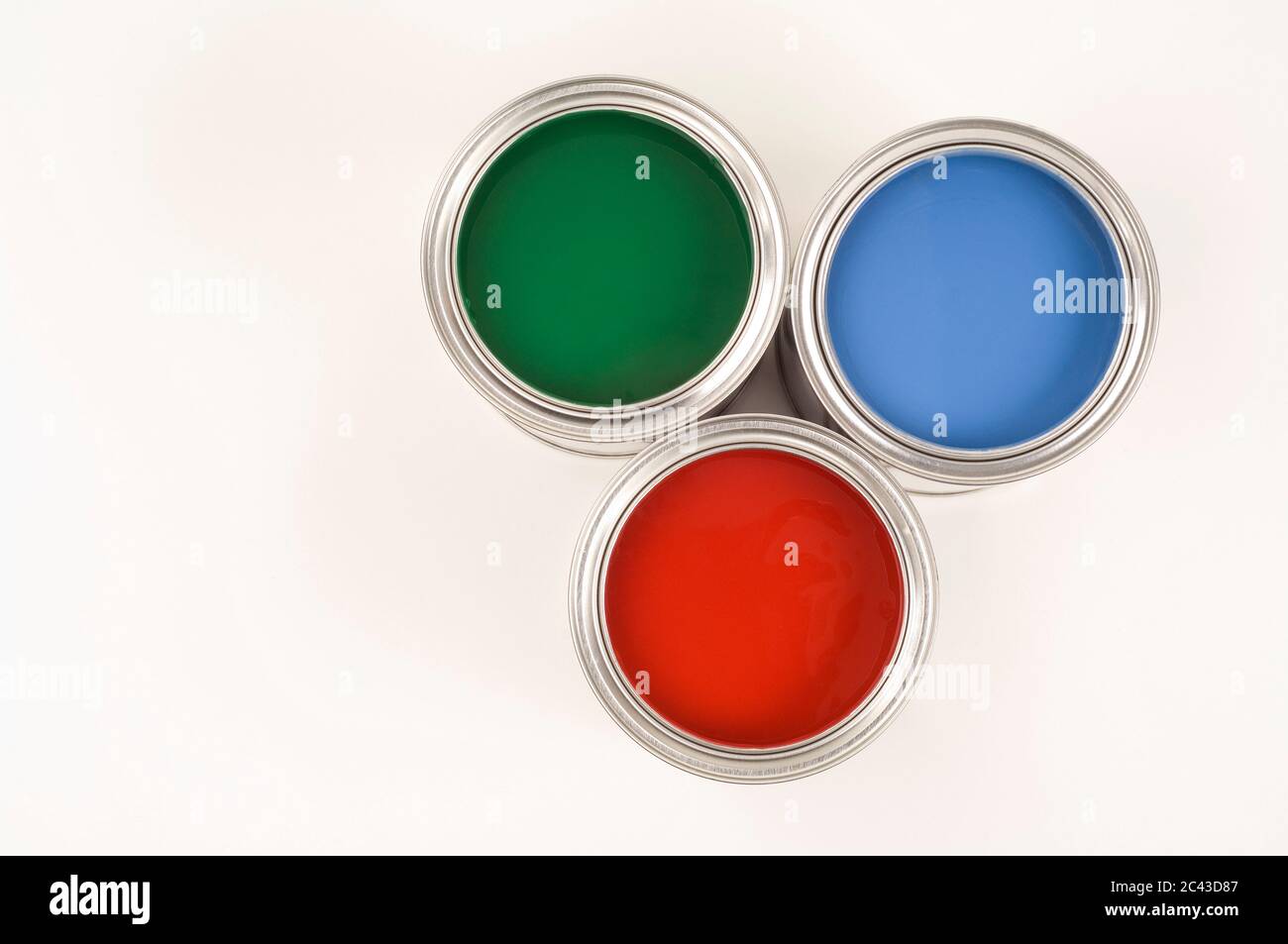 Three cans of red, blue and green color Stock Photo - Alamy
