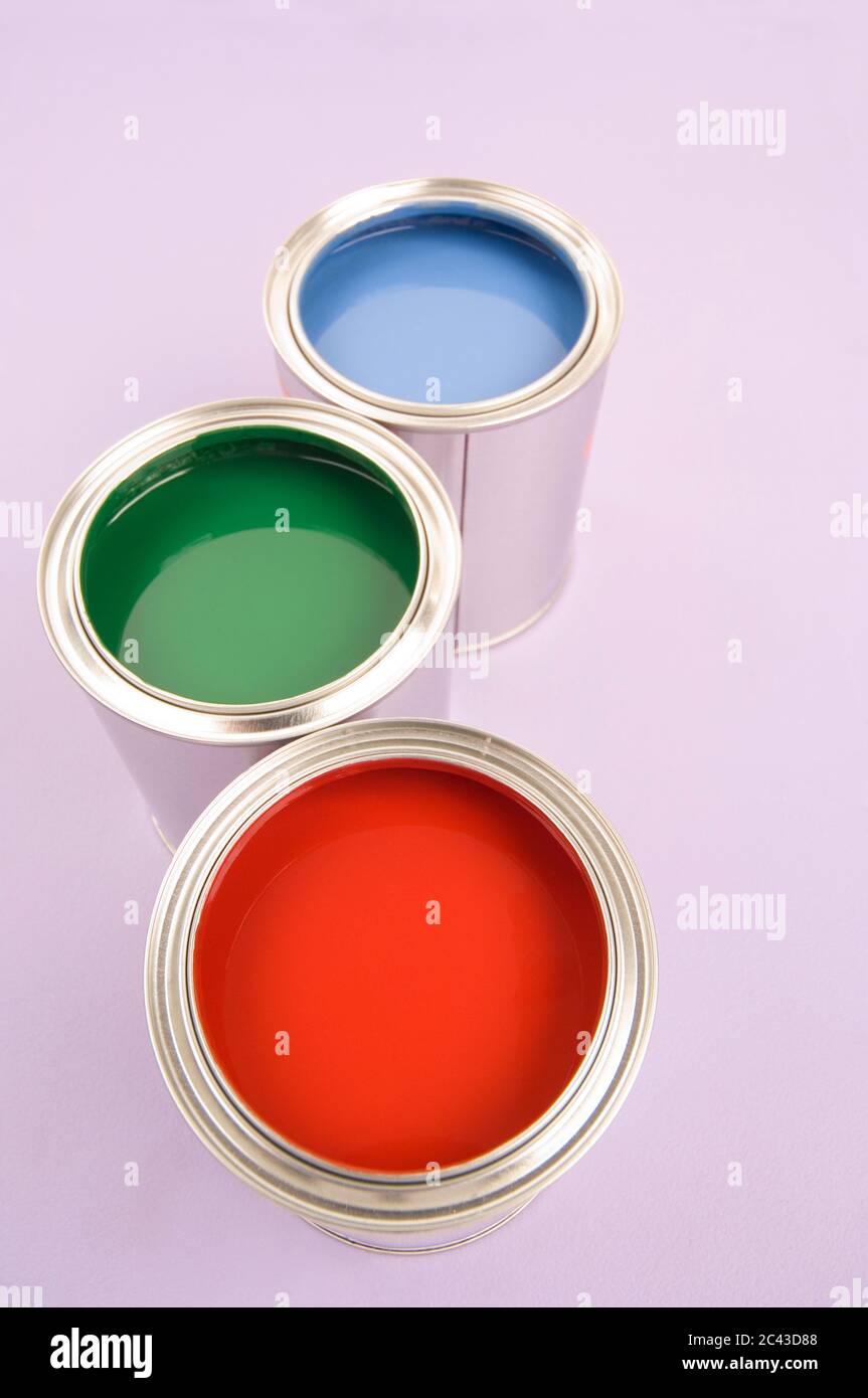Three cans of red, blue and green color Stock Photo - Alamy