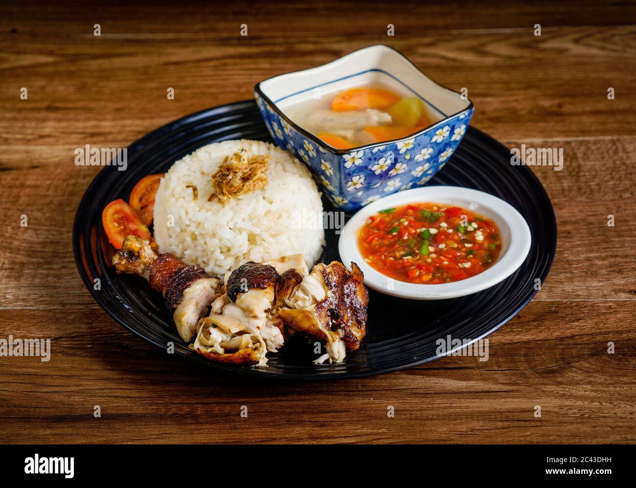Chicken rice with chopped roasted chicken served with spicy chili ...