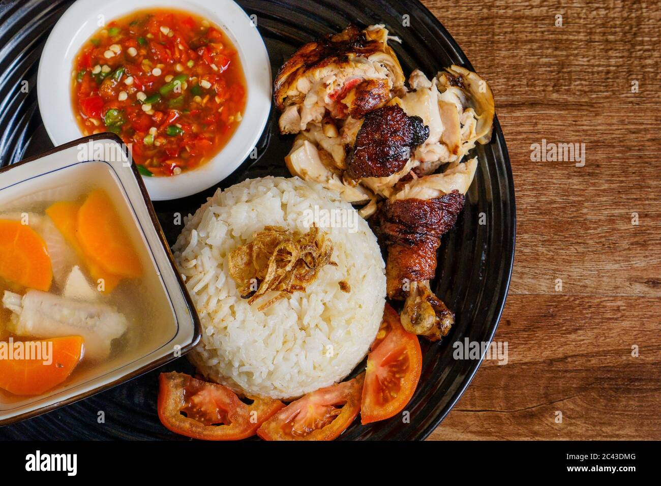 Chicken rice with chopped roasted chicken served with spicy chili ...