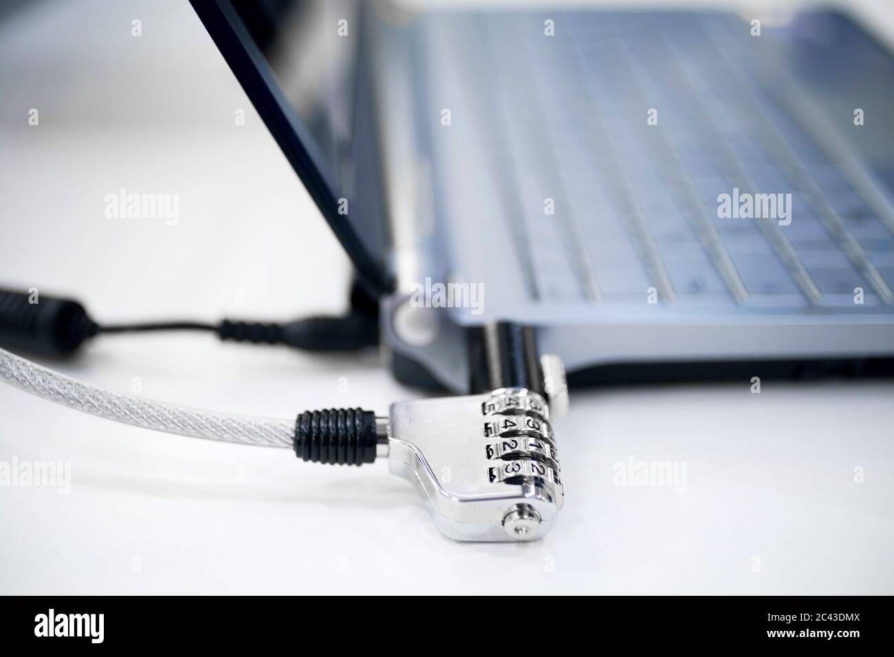 Laptop with a combination lock Stock Photo - Alamy